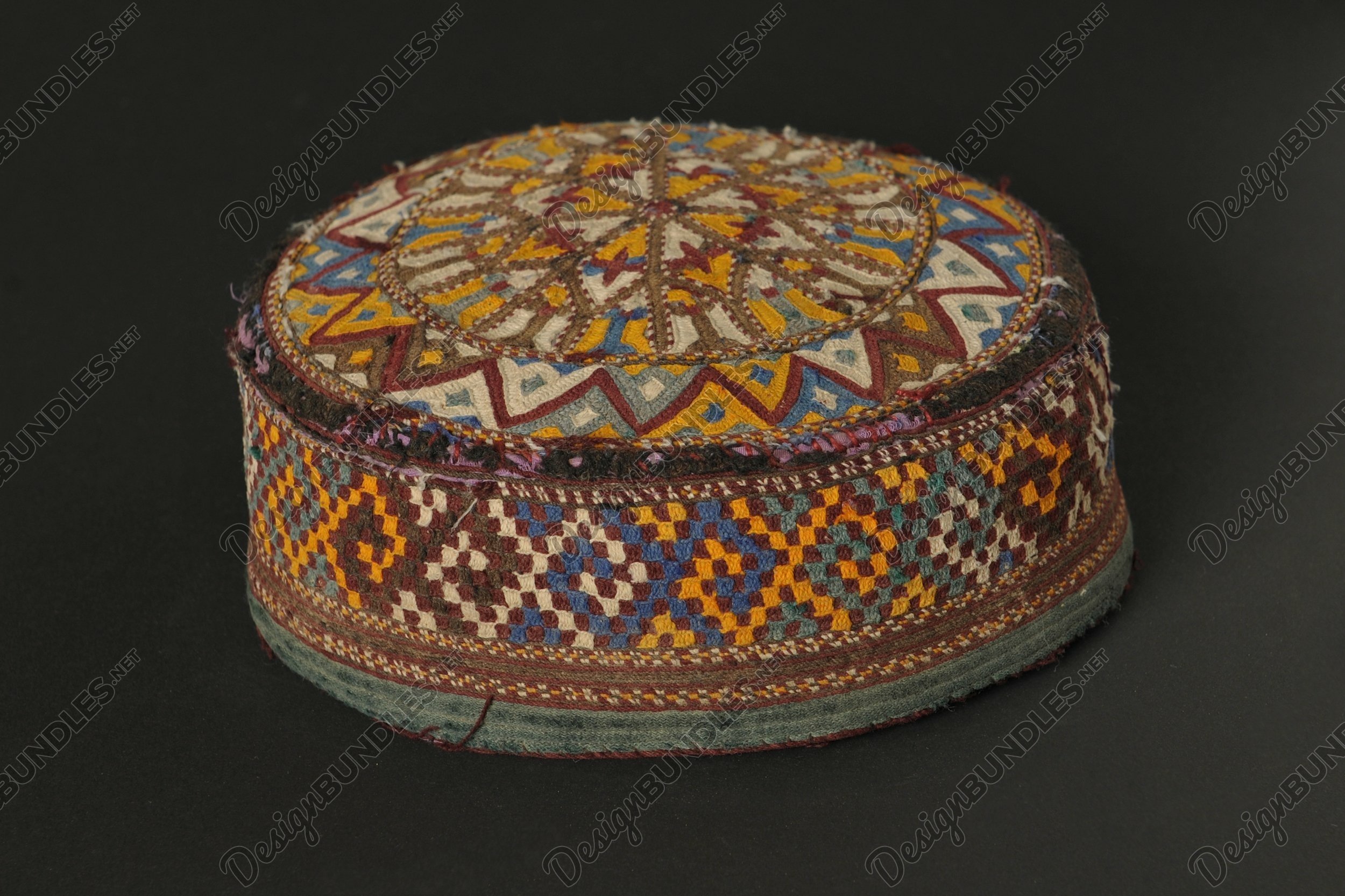 Colorful traditional asian skullcap cap on a dark background (1221765 ...