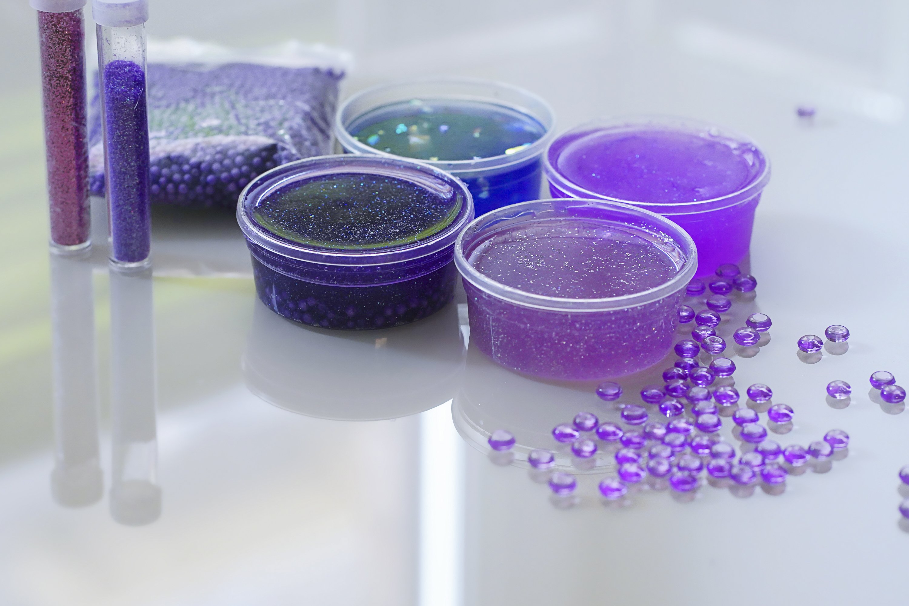 lilic, violet, blue slimes inside plastic boxes (621147) | Arts and ...