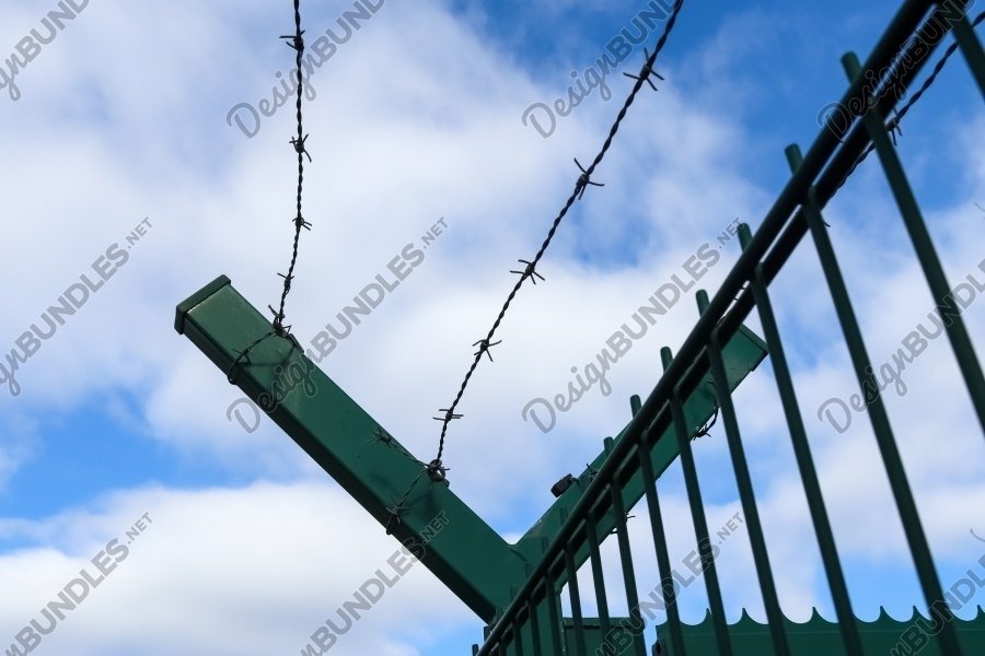 Barbed wire at a border fence (1844235) | Conceptual | Design Bundles