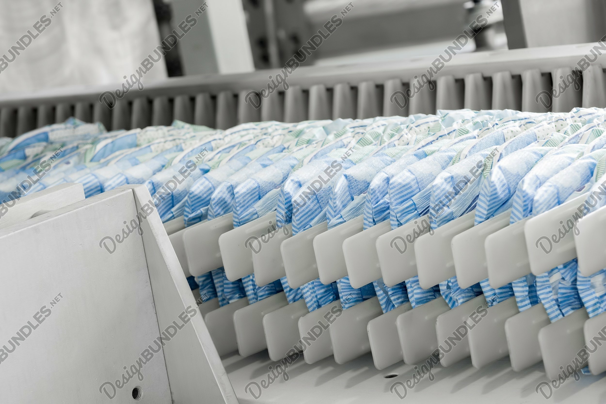Diapers on a conveyor belt. Industrial equipment (1252343) | Industry ...