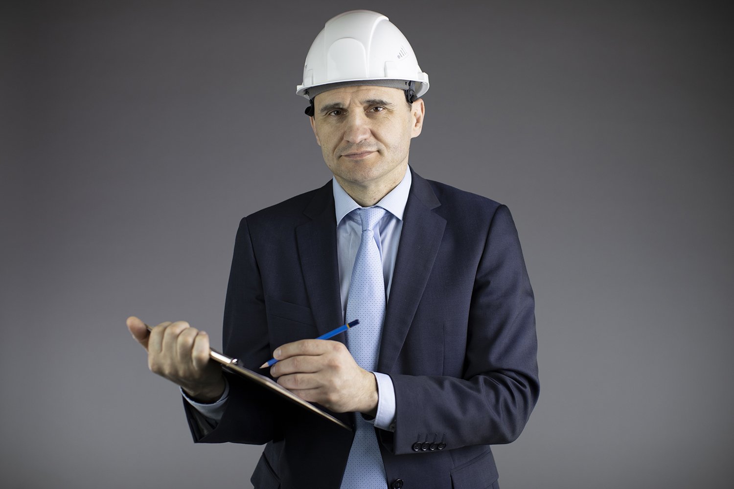 Concerned builder in white helmet and formal clothing (589965) | People ...