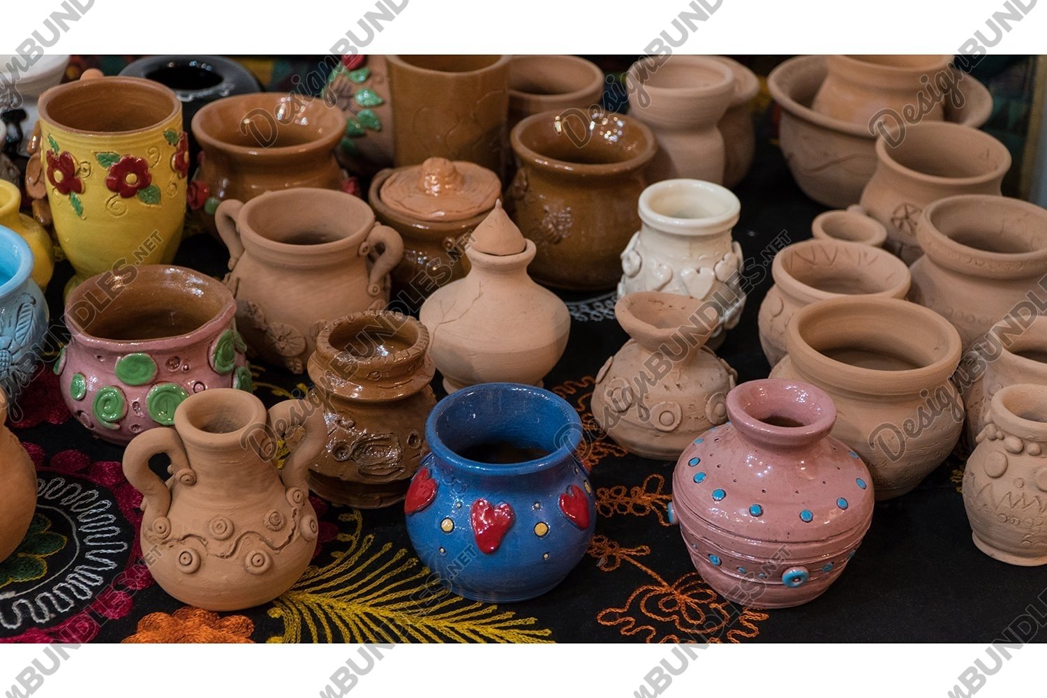 Lots of beautifully decorated clay pots. Children's crafts (896459 ...