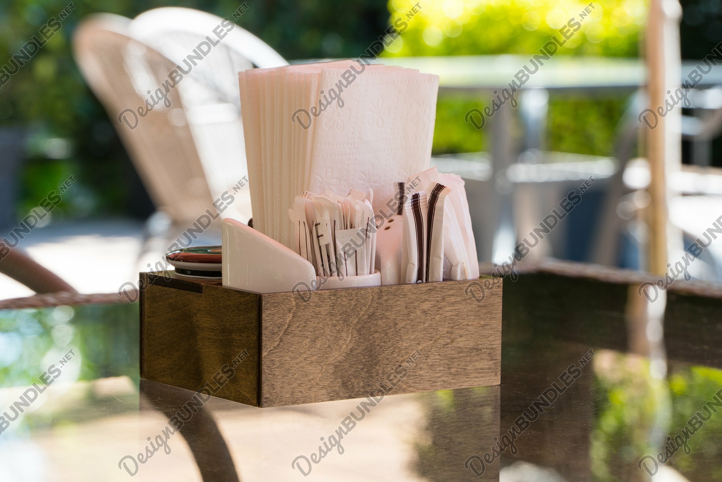 Box with paper napkins on a glass table. Outdoor summer cafe (1167023 ...