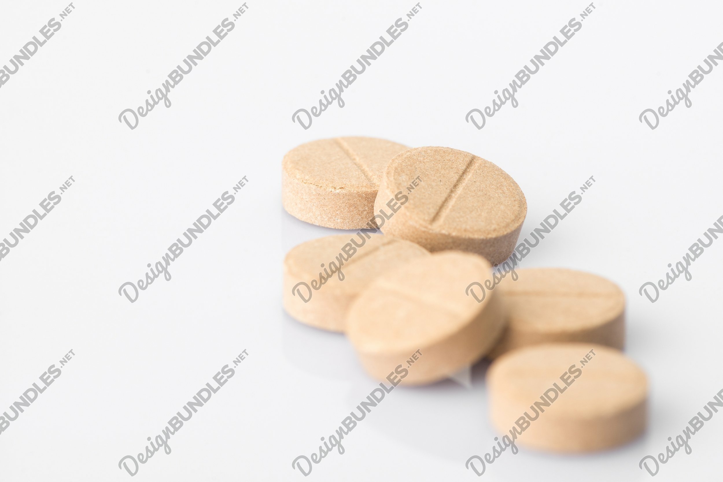 Beige medical tablets on a light background. Top view (1183944 ...