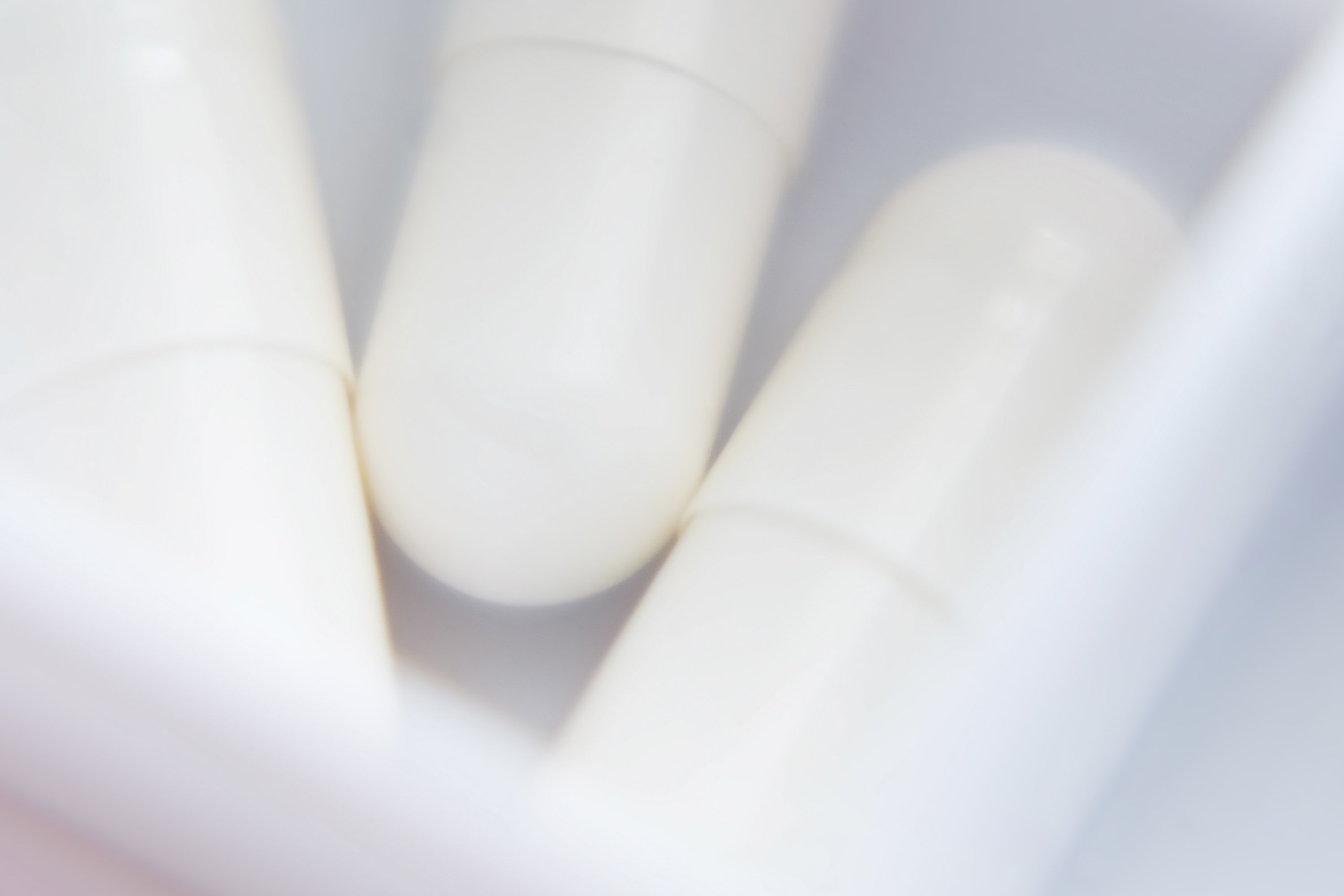 Blurry different pills close-up (623419) | Science | Design Bundles