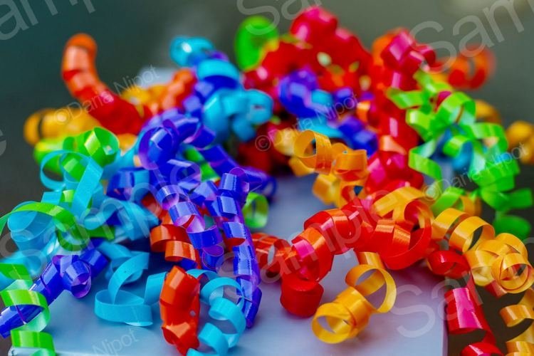 Colourful spiral curly ribbon on a gift box (596543) | General | Design ...