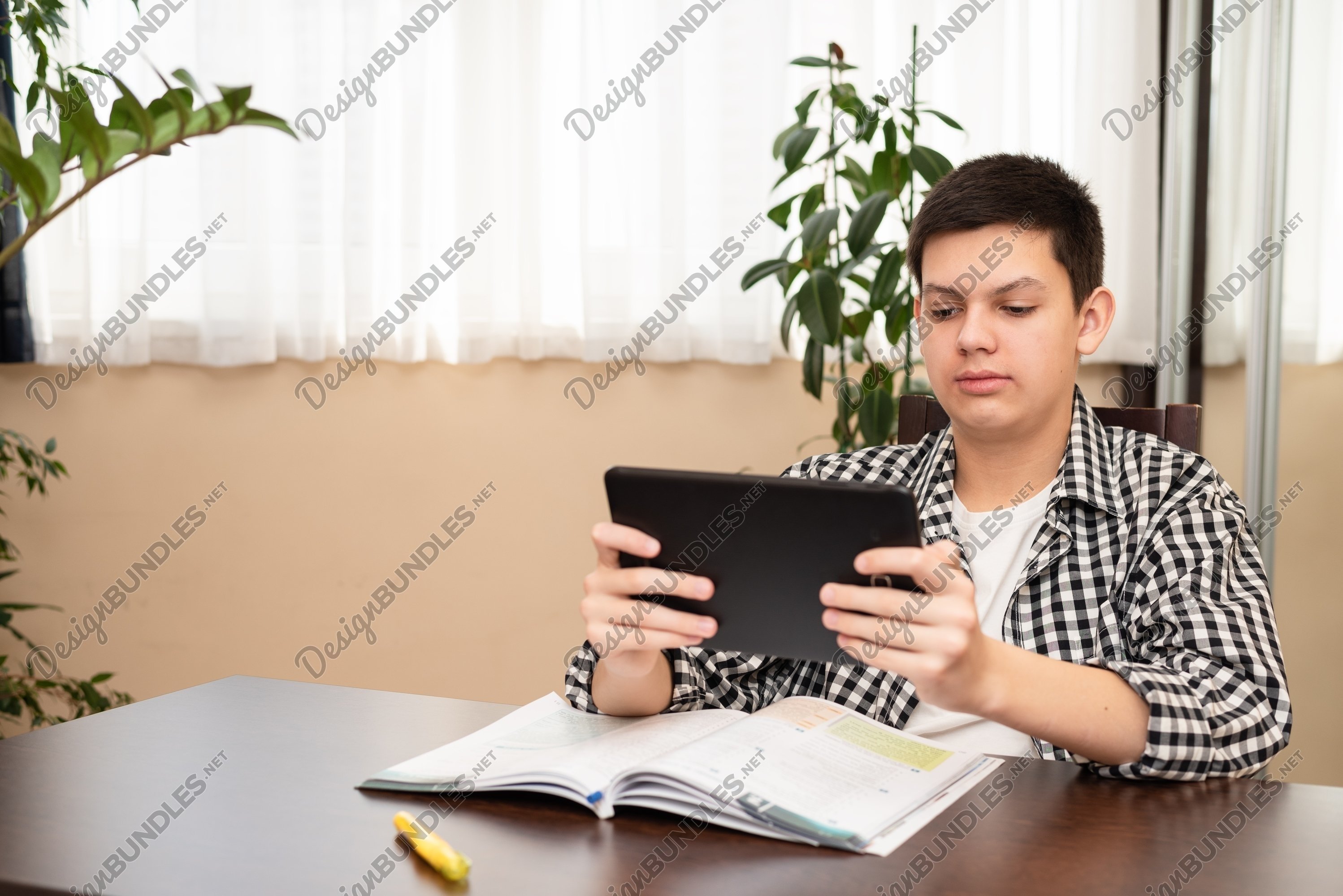 Teenage boy learning language online using digital tablet (593953 ...