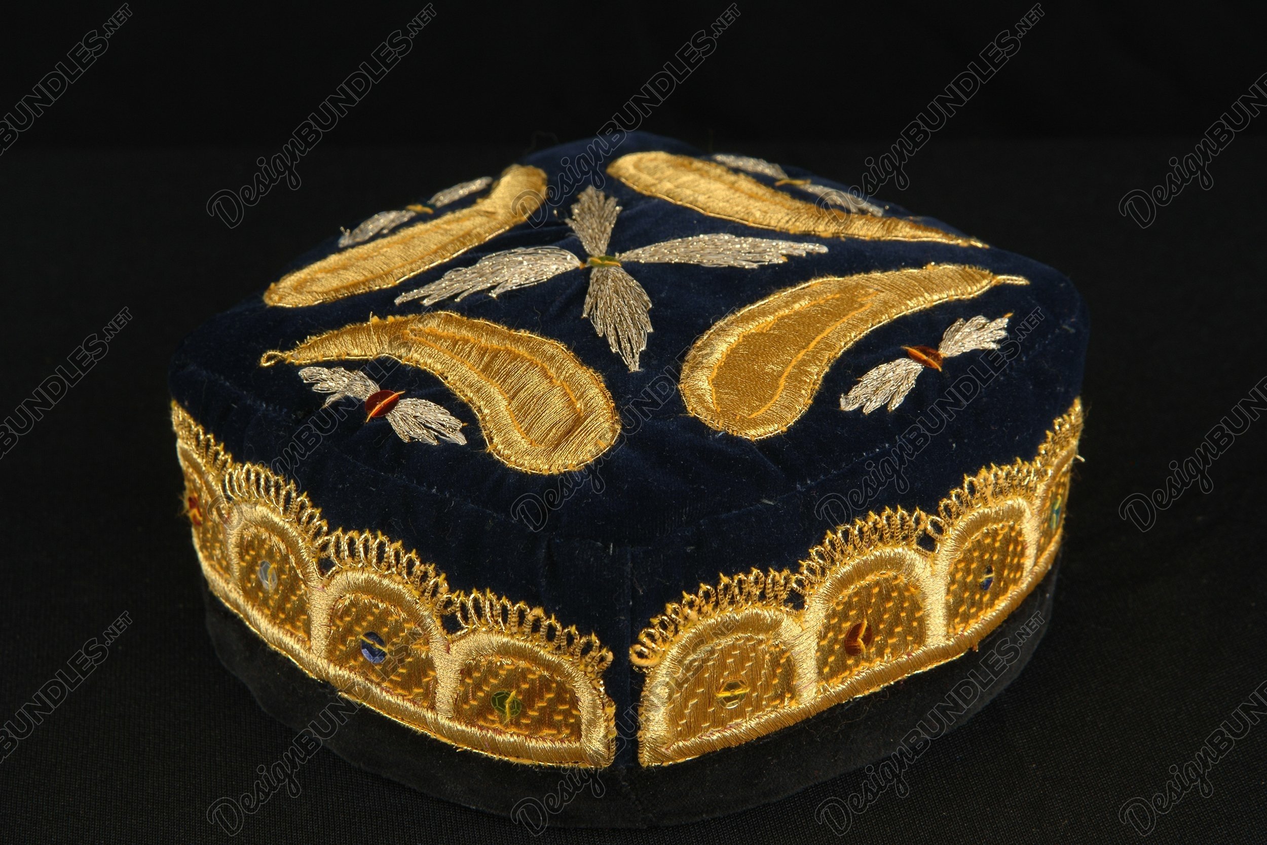 Gold colored traditional asian skullcap cap on a dark (1221818 ...