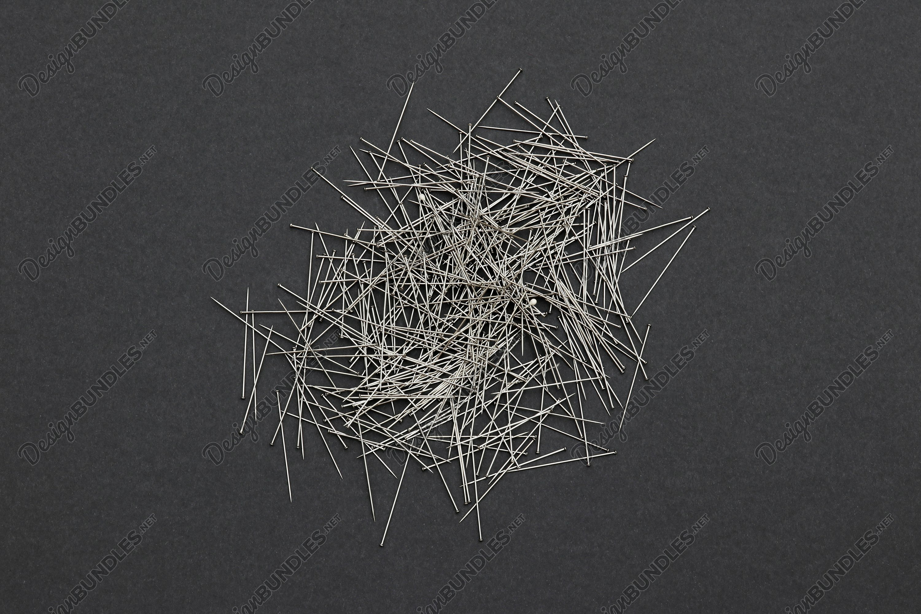 Pins on a black background (1259368) | Conceptual | Design Bundles
