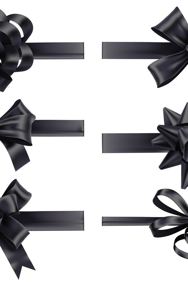 Realistic black ribbons with bows. Dark festive wrapping bow