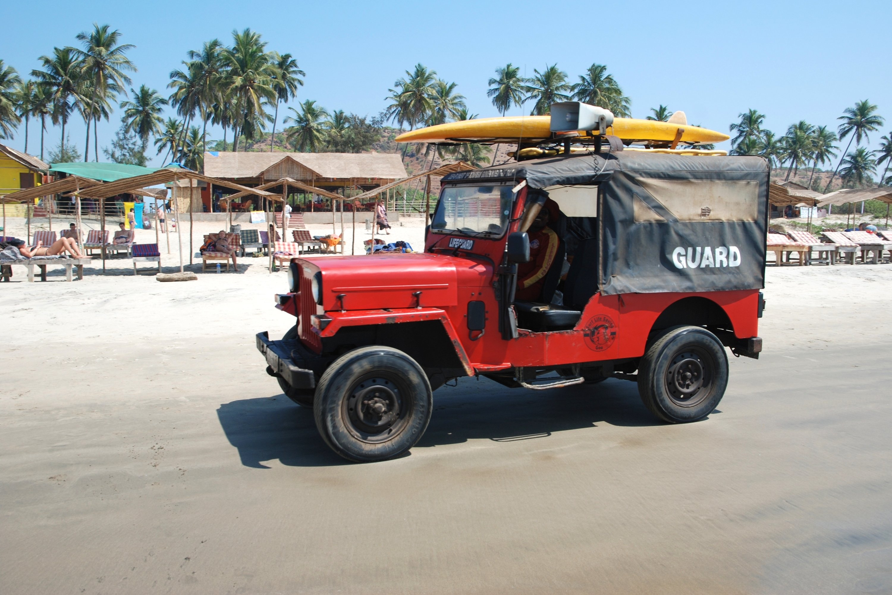 Car on the beach.
