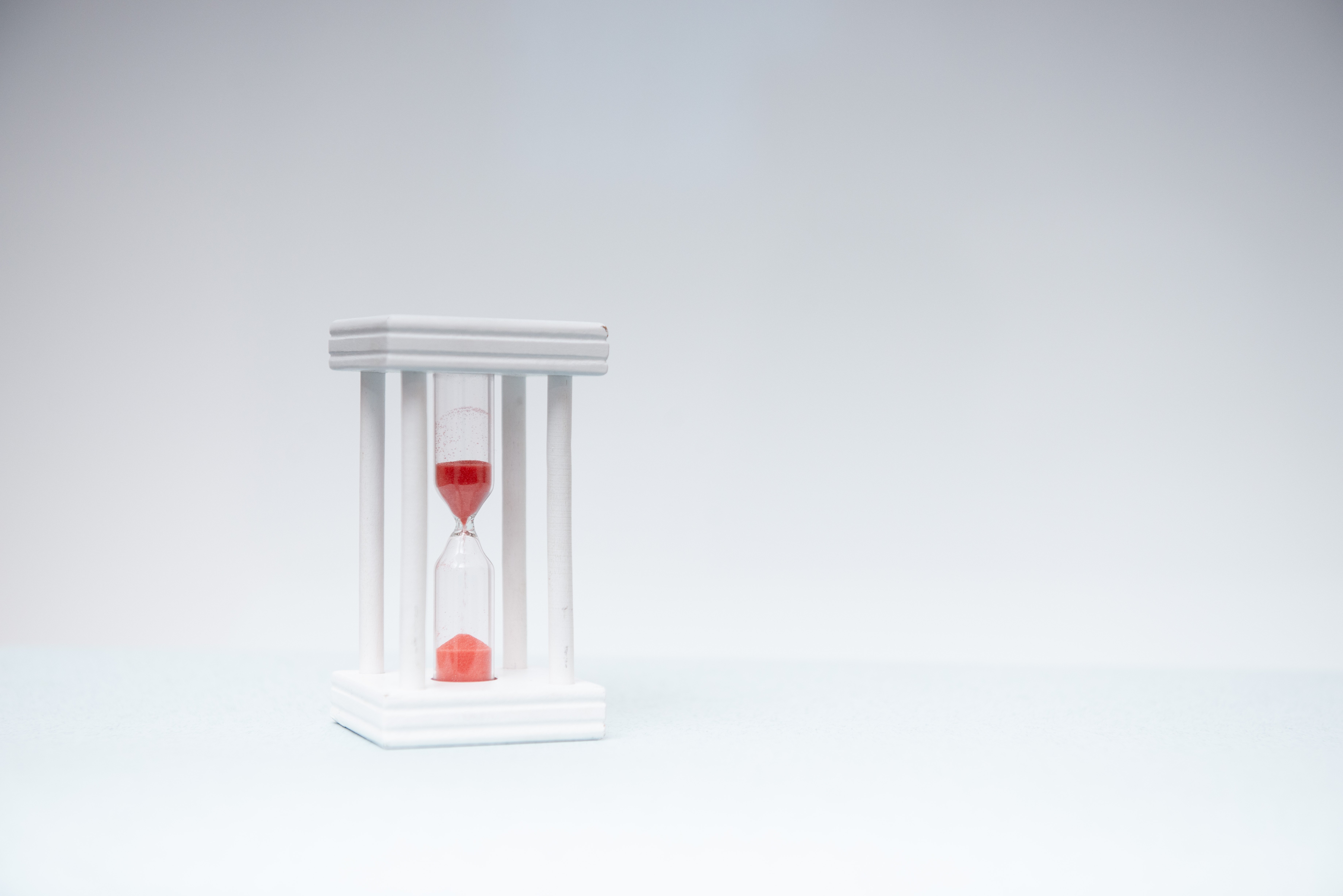hourglass in a white wooden case