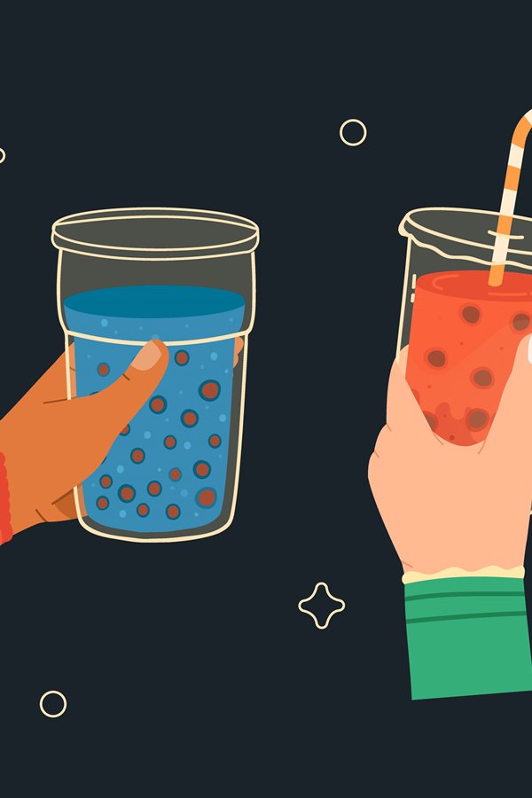 Bubble tea cups in hands. Sweet boba tea, hand holding bubbl