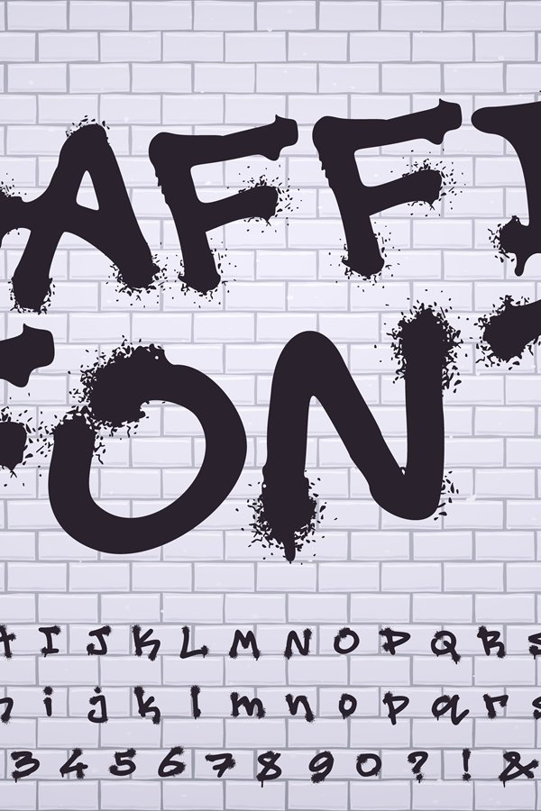 Spray graffiti letters. City street art wall