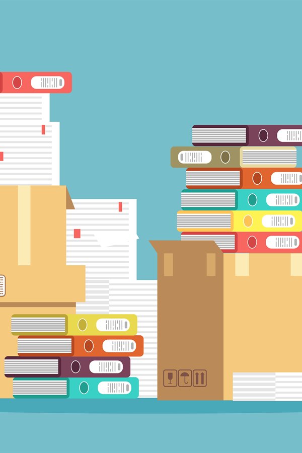 Pile of cardboard boxes, paper documents and office file fol