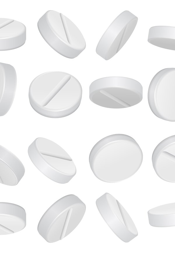 Tablets, pills, drugs in different positions isolated on whi