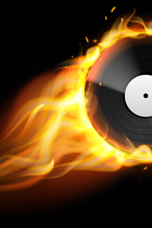 Burning vinyl record. Realistic analog audio disc with fire