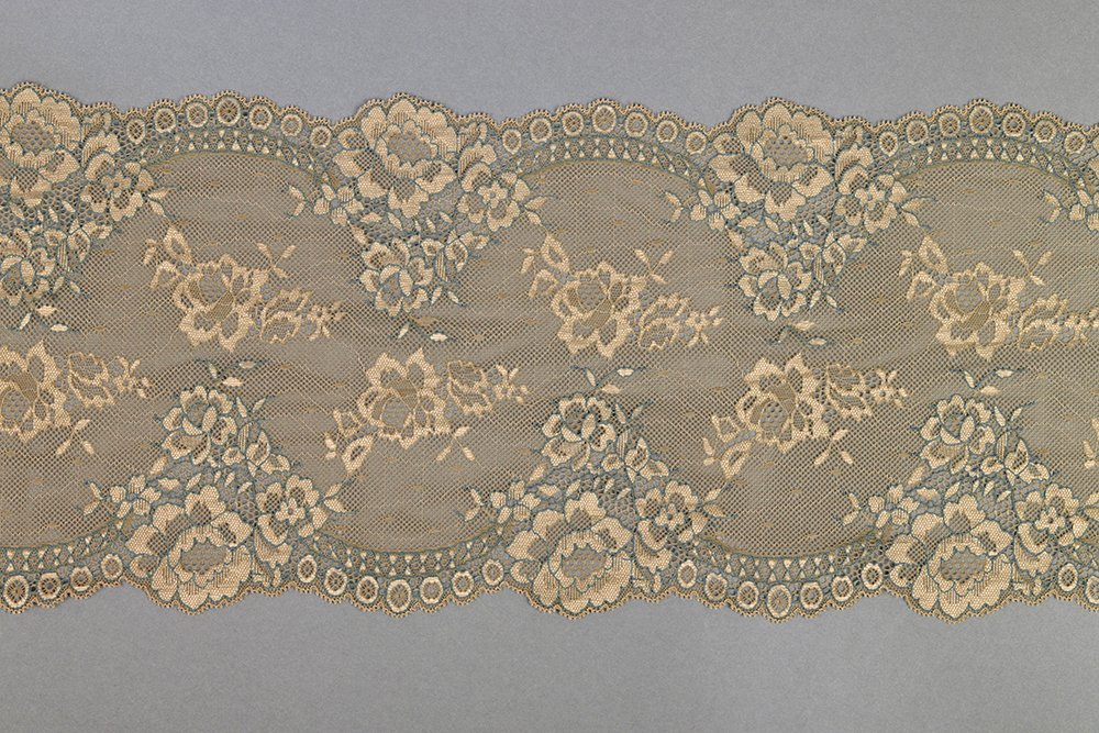Beige straight strip of lace fabric. Texture for (1216969)