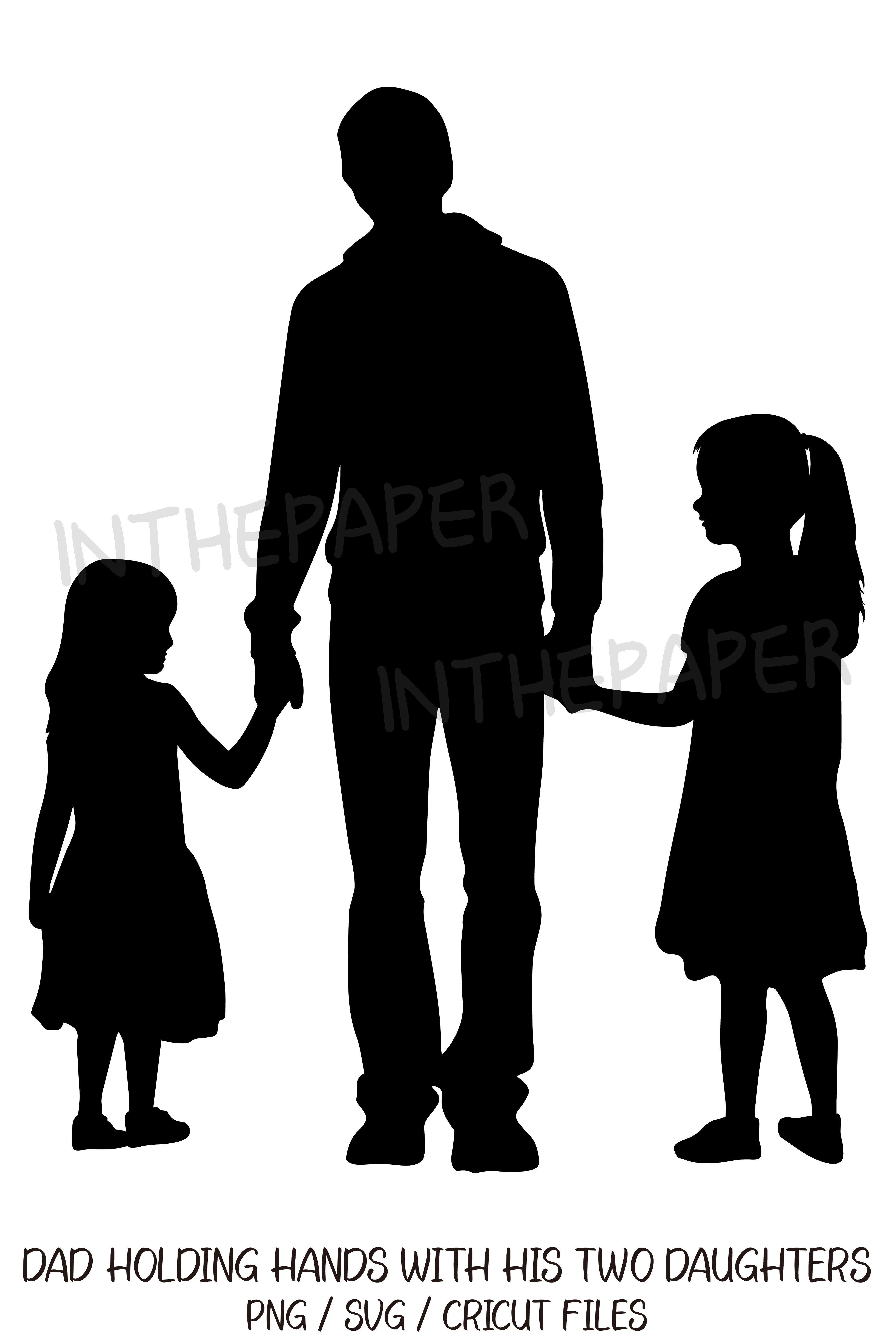 Dad holding hands with his two daughters | (2632181)