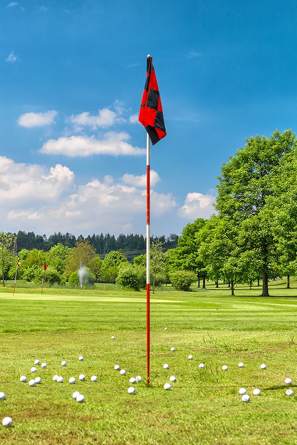 Golf course red flag green golf field. Golf club
