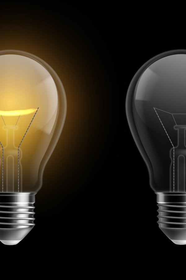 Light bulb realistic. Glowing and turned off isolated on bla