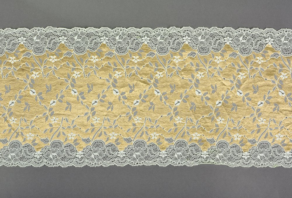 Yellow straight strip of lace fabric. Texture for (1216973)