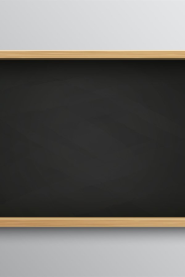 Blank retro class blackboard with chalk pieces. Empty black