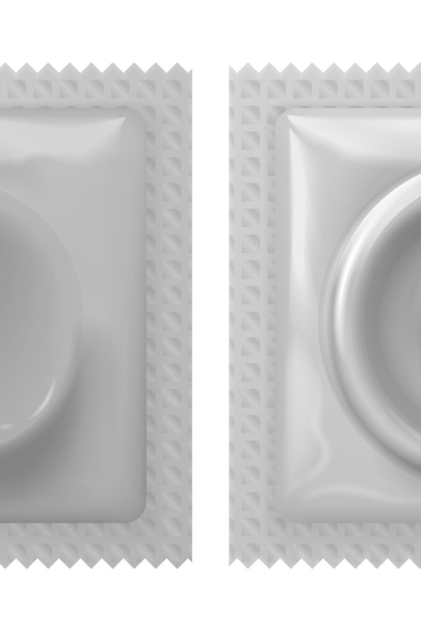 Realistic condom in pack. Latex contraceptive for man penis.