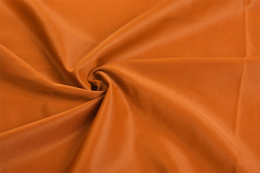 Abstract backdrop of Orange texture curl fabric. (1104964)