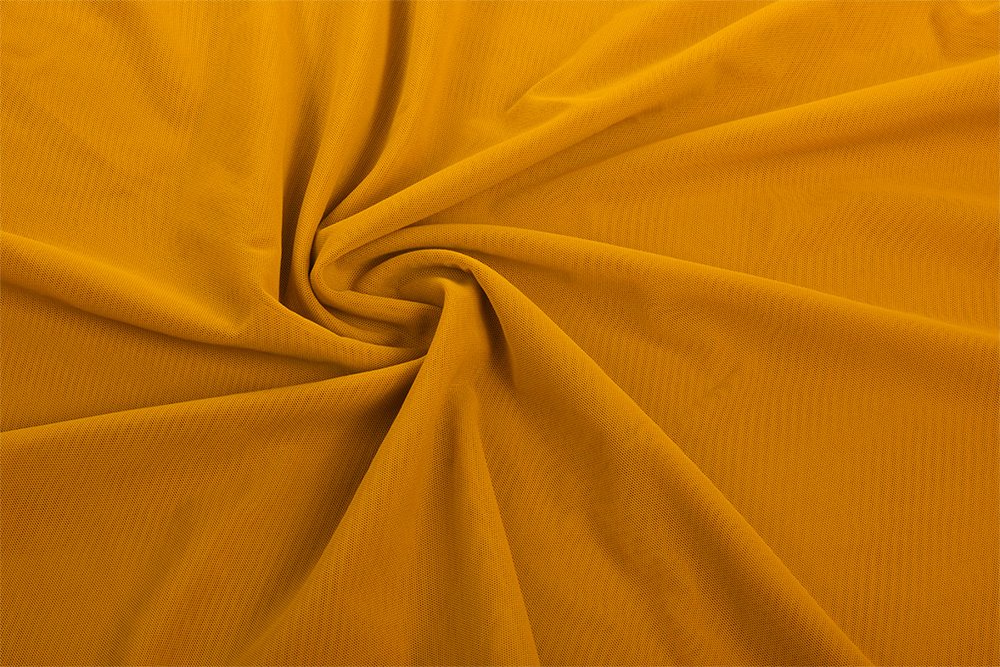 Abstract backdrop of Orange texture curl fabric. (1104960)