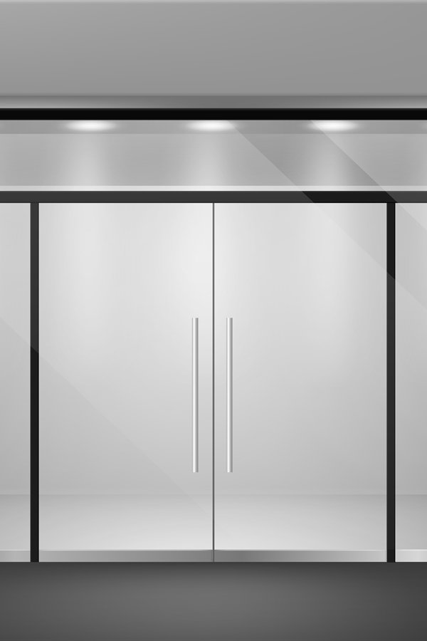 Store front. View from outside to empty shop boutique interi