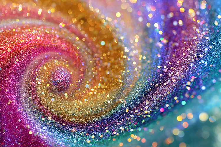 A swirling pattern of glittering lights and colors