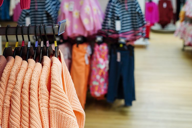 Children clothes hanging on hangers in the shop (2584826)