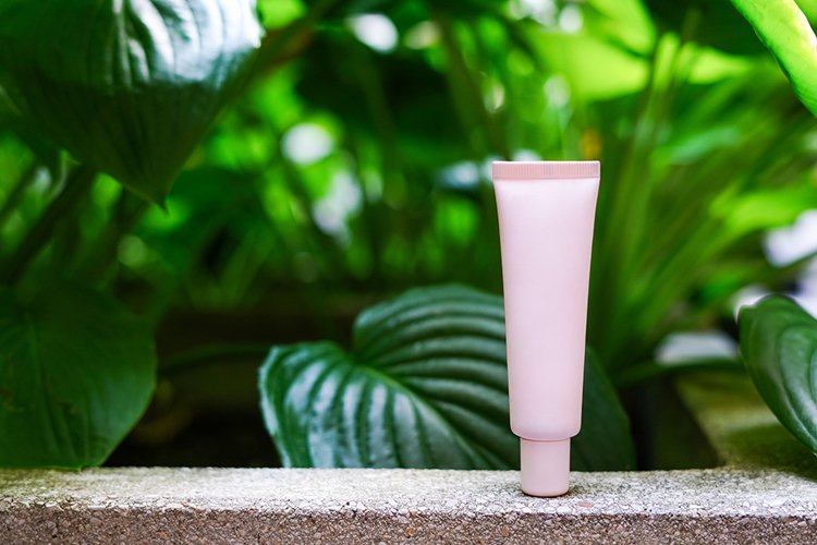 Cosmetic pink tube with facial moisturizer cream