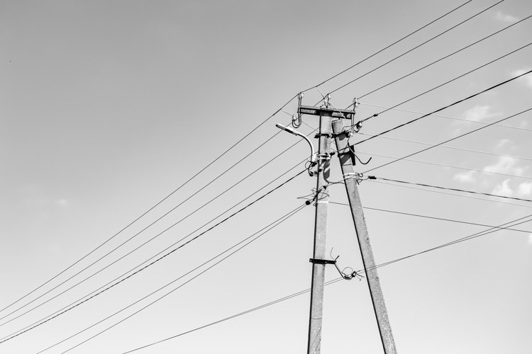 Power electric pole with line wire on coloured background