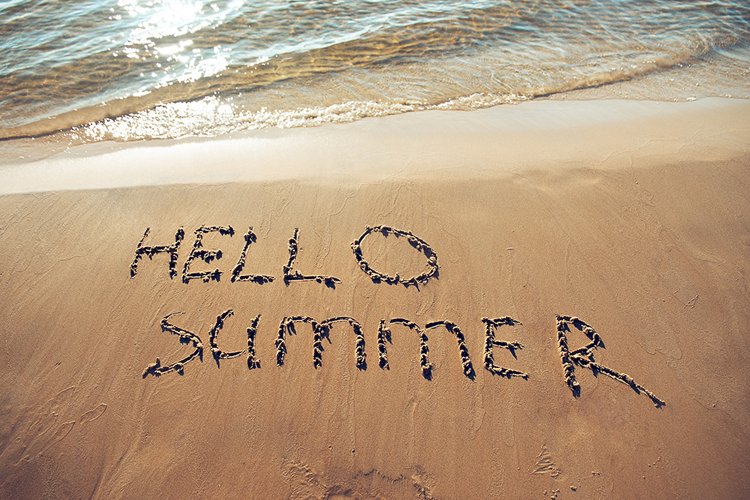 Hand drawn message Hello summer on wet yellow sand on beach