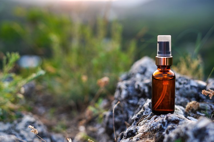 essential oil staying on the stone, nature background