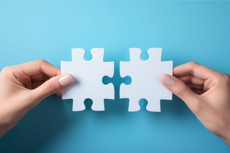 Hands connecting white puzzle on blue background. Generate a