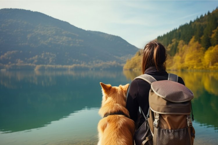 Tourist woman with her dog admiring scenic lake view. Genera
