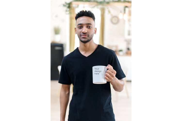 Arab man with white mug mockup in home interior
