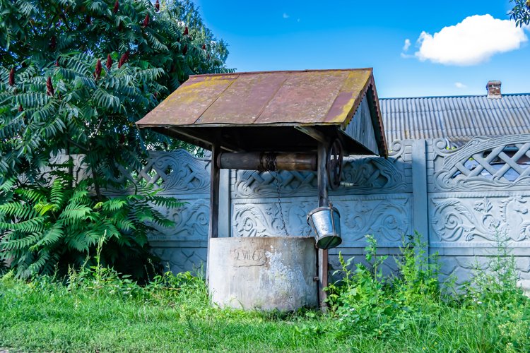 Well with bucket on forged chain for clean drinking water