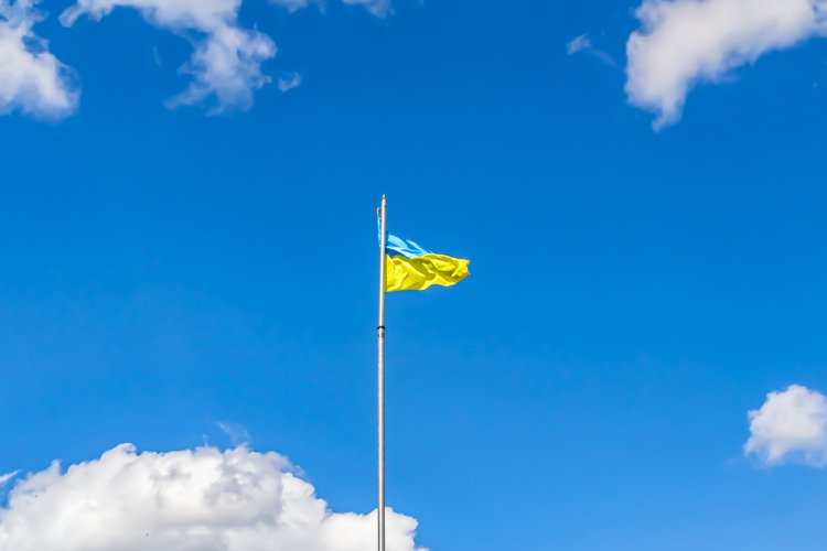 national Ukrainian flag in peaceful sky fluttering in wind