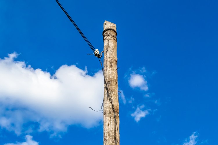 Power electric pole with line wire on coloured background