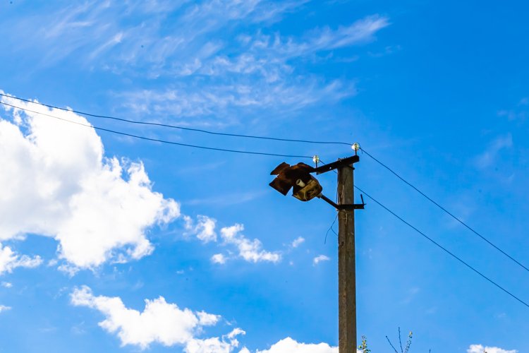 Power electric pole with line wire on coloured background
