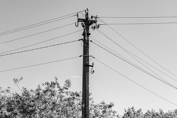 Power electric pole with line wire on coloured background