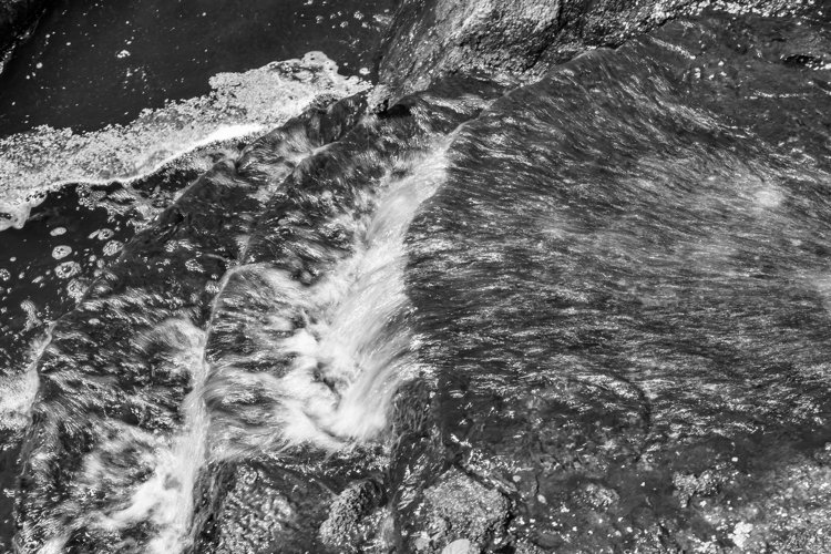 Beautiful fall water from garden waterfall, natural texture