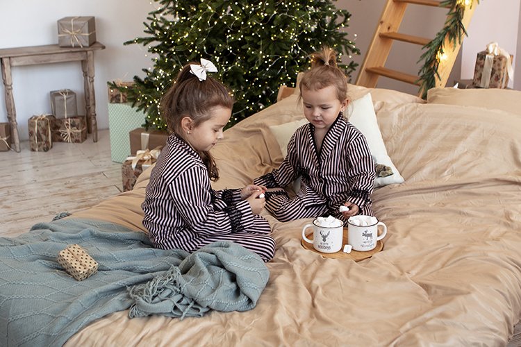 two sisters girls sorting presents in Christmas (2602678)