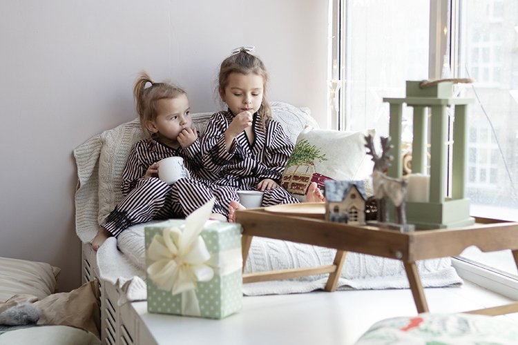 two sisters girls sorting presents in Christmas (2612090)